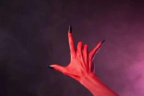 Heavy metal, red devil hand with black nails Stock Photo by ©Elisanth ...