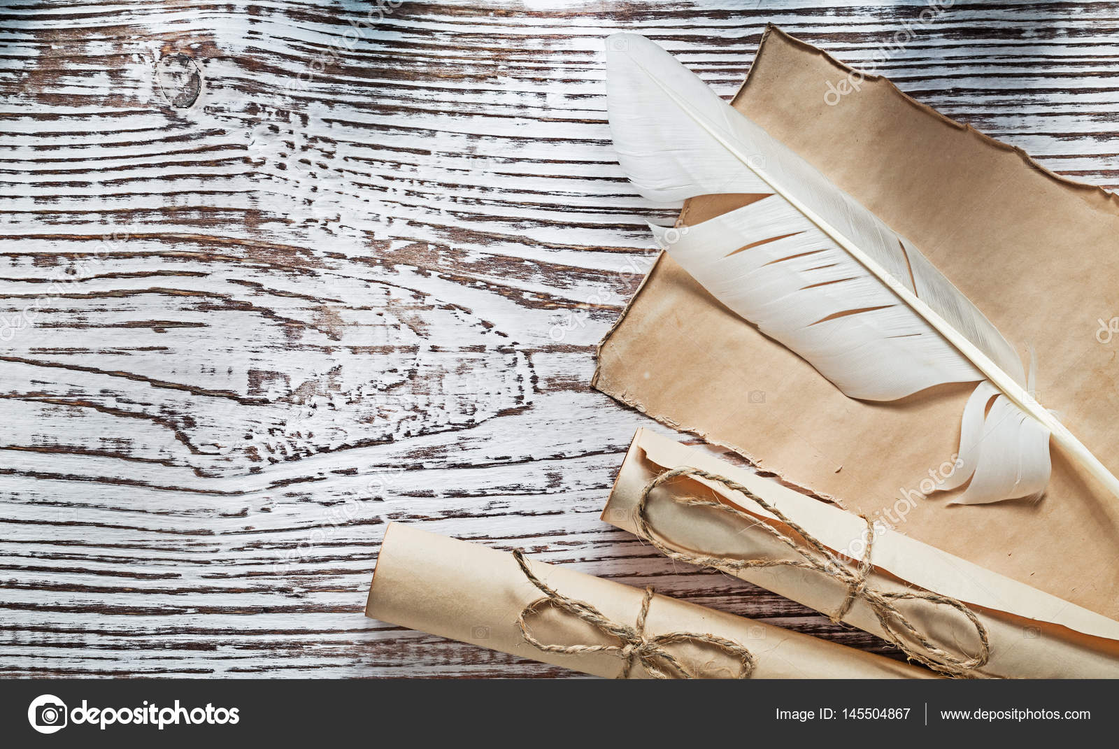 Medieval parchment paper rolls plume on vintage wooden board Stock ...