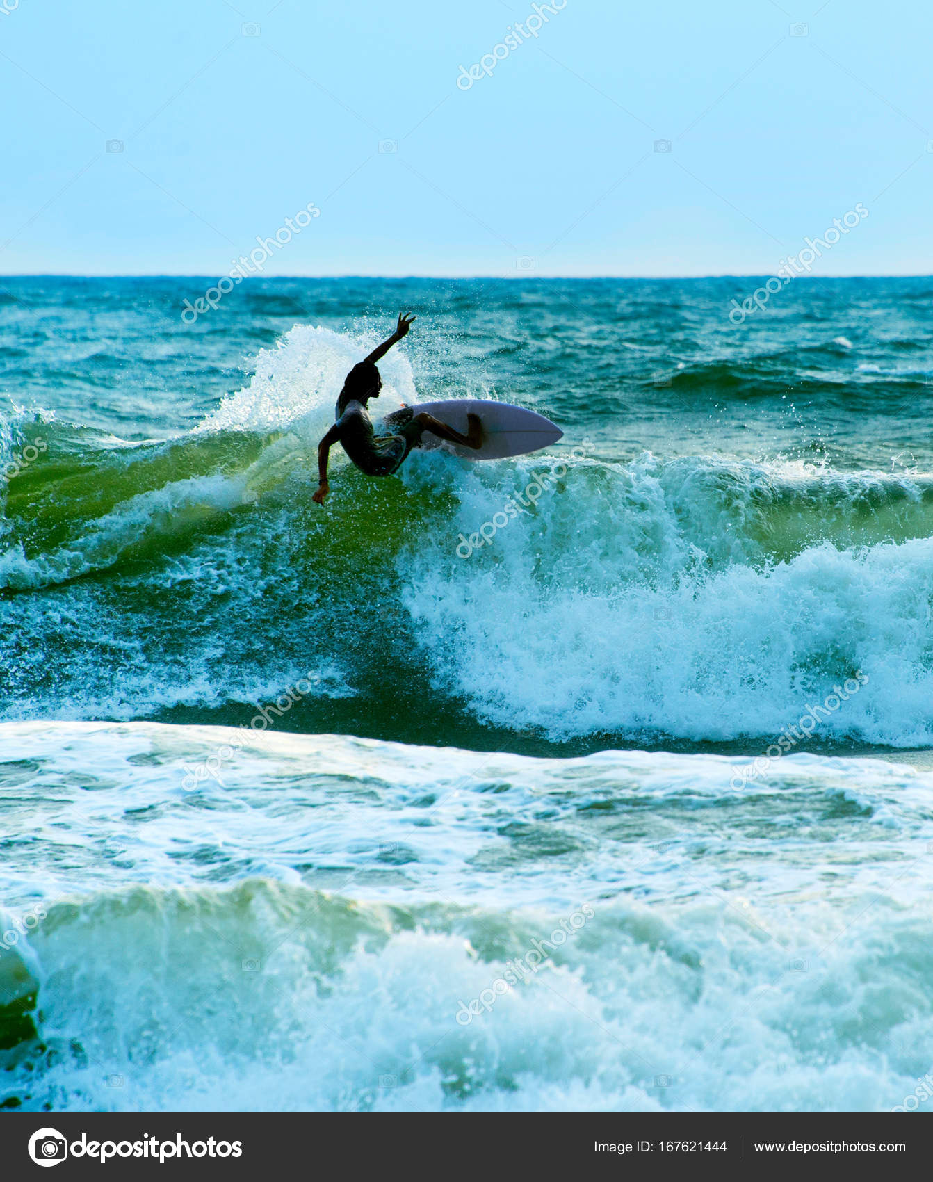 Surfer in the ocean. Bali — Stock Editorial Photo © joyfull #167621444