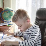 Boy is doing math homework Stock Photo by ©sommersby 312467618