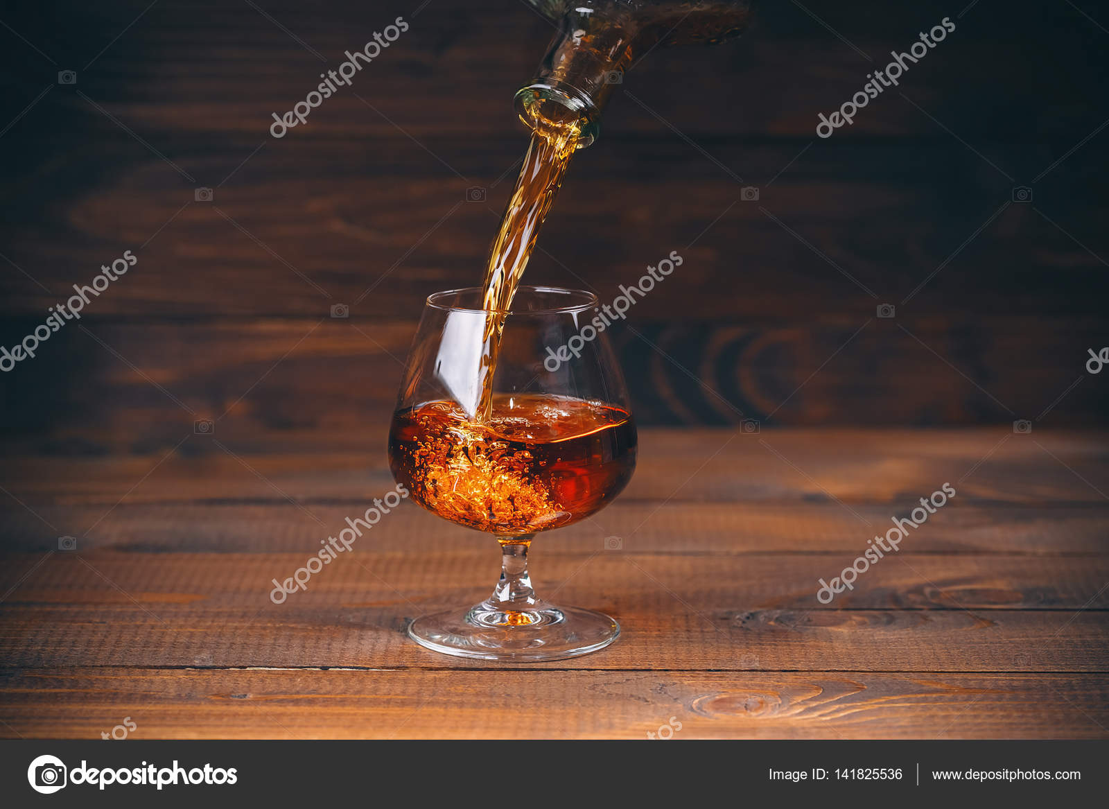 Pouring brandy from bottle Stock Photo by ©jeka2009 141825536