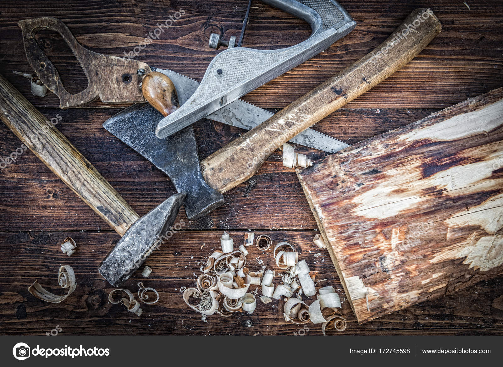 Old carpentry tools on the wooden board Stock Photo by ©scorpp 172745598