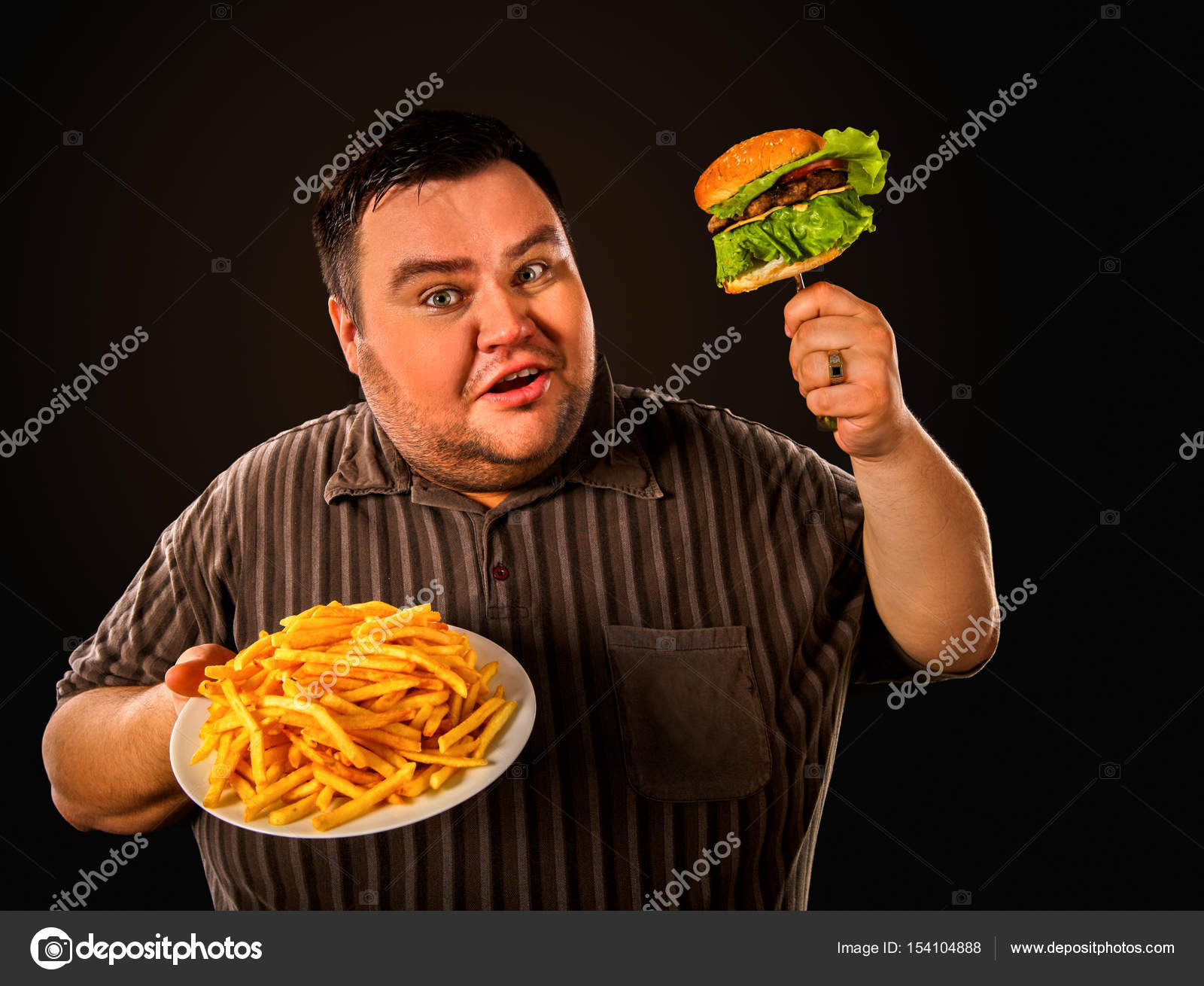 Fat man eating fast food hamberger. Breakfast for overweight person ...