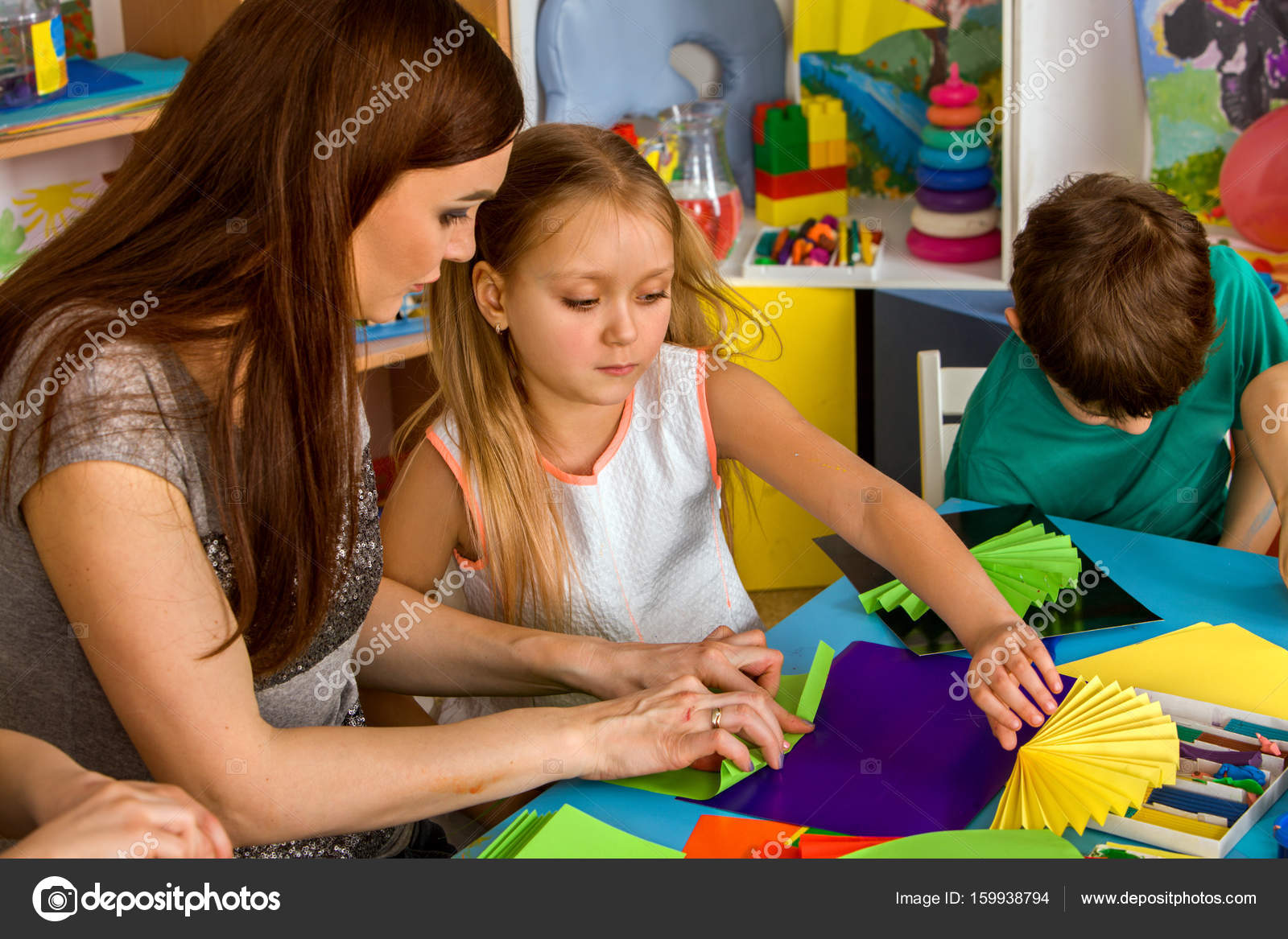 School children with scissors in kids hands cutting paper . Stock Photo ...