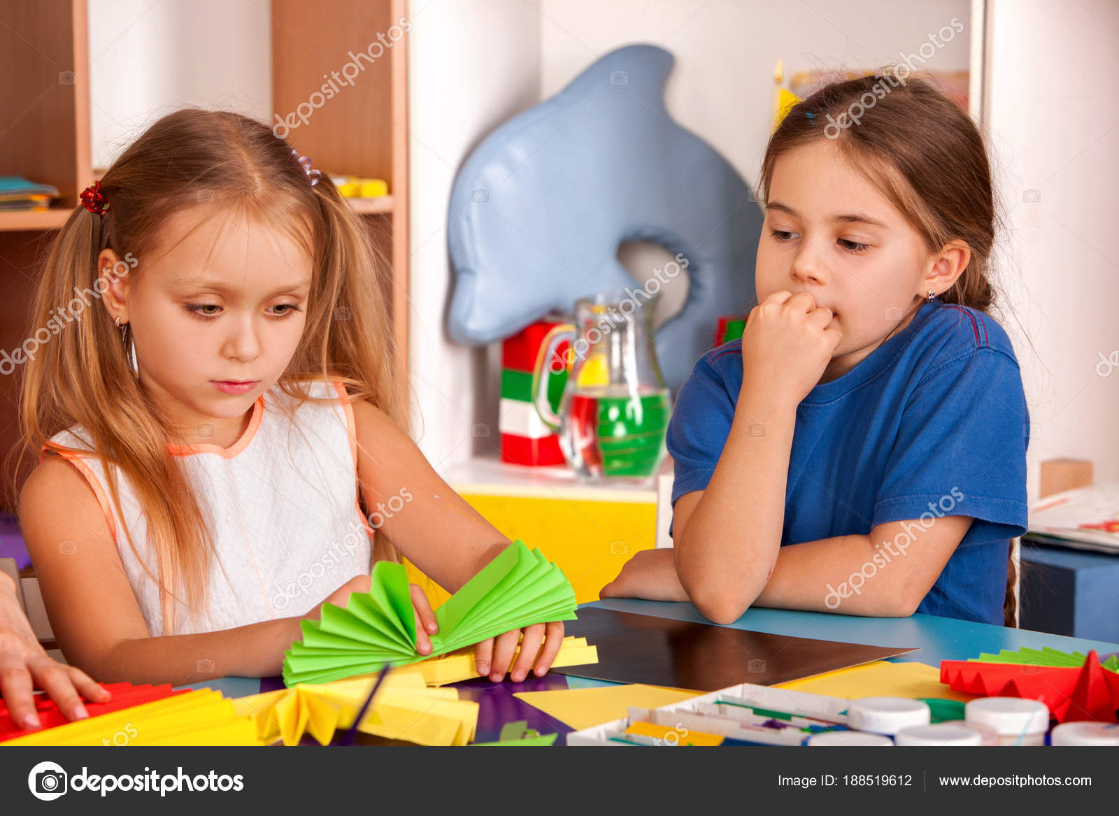 School children with scissors in kids hands cutting paper . Stock Photo ...
