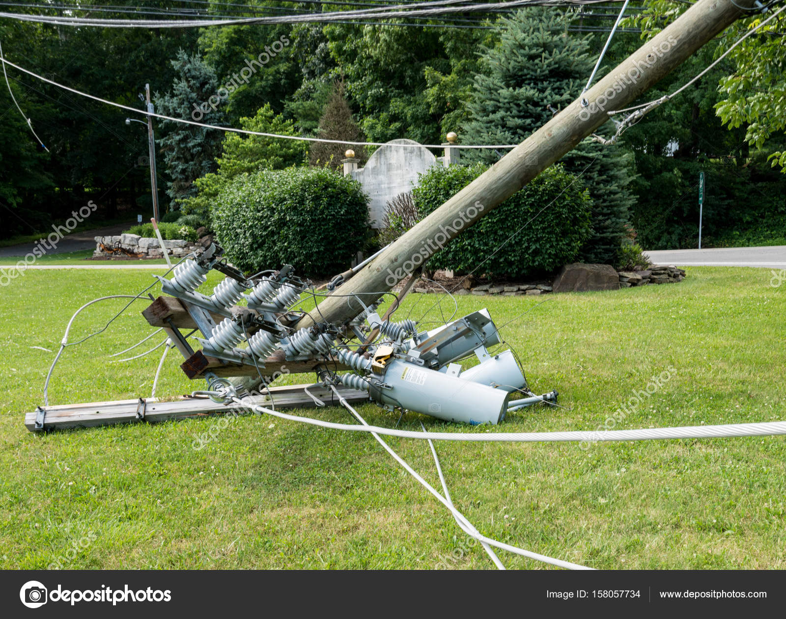Snapped and downed power post and line after storm Stock Photo by ...