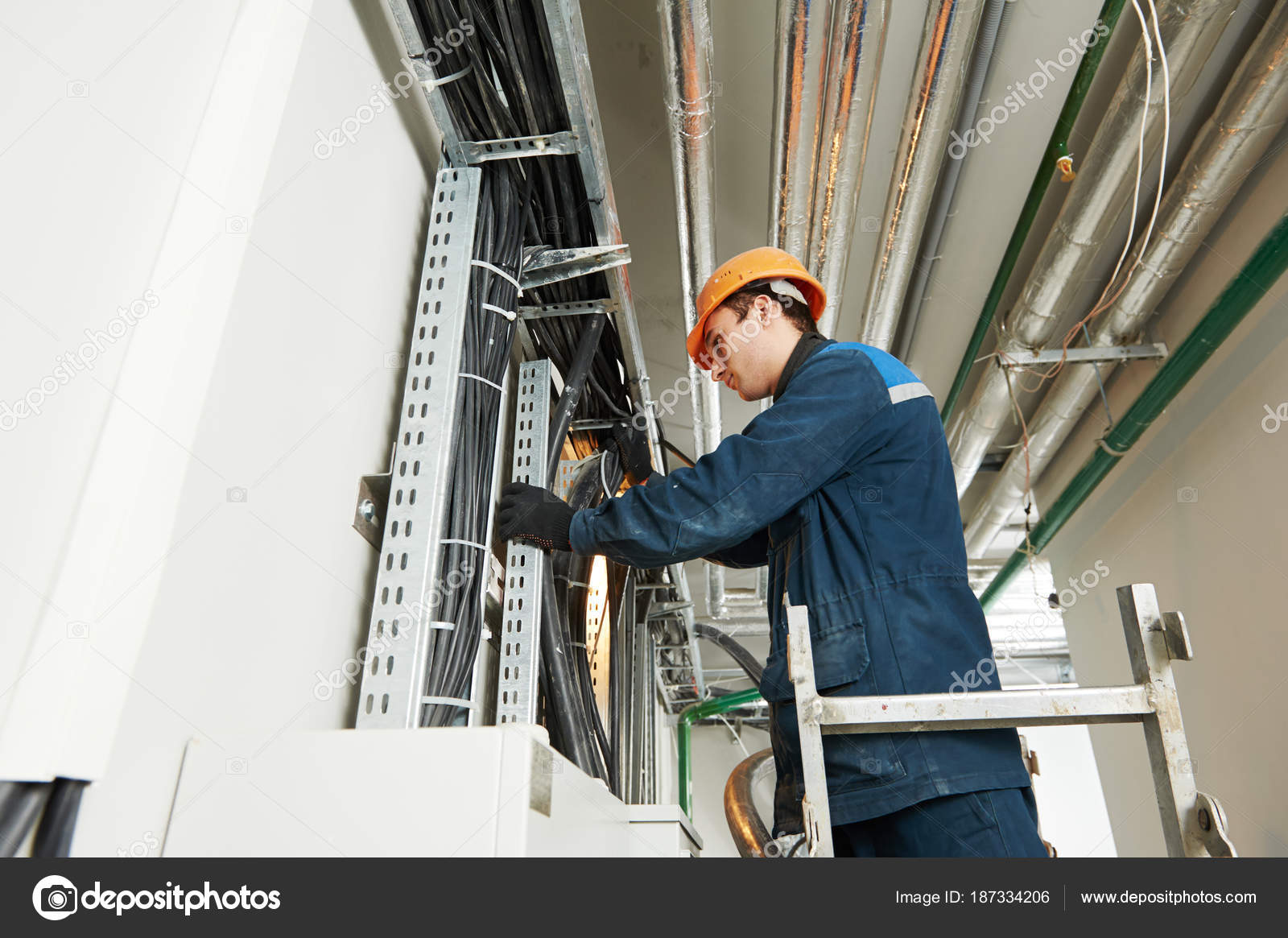 Two electrician workers at cabling Stock Photo by ©kalinovsky 187334206