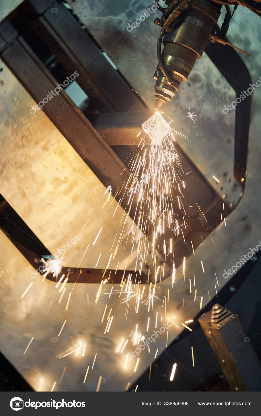 Laser cutting of metal pipe with sparks on tube laser machine Stock ...