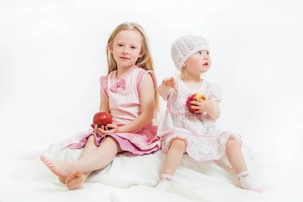 Two little girls eat sweet cherry — Stock Photo © sveter #157413076