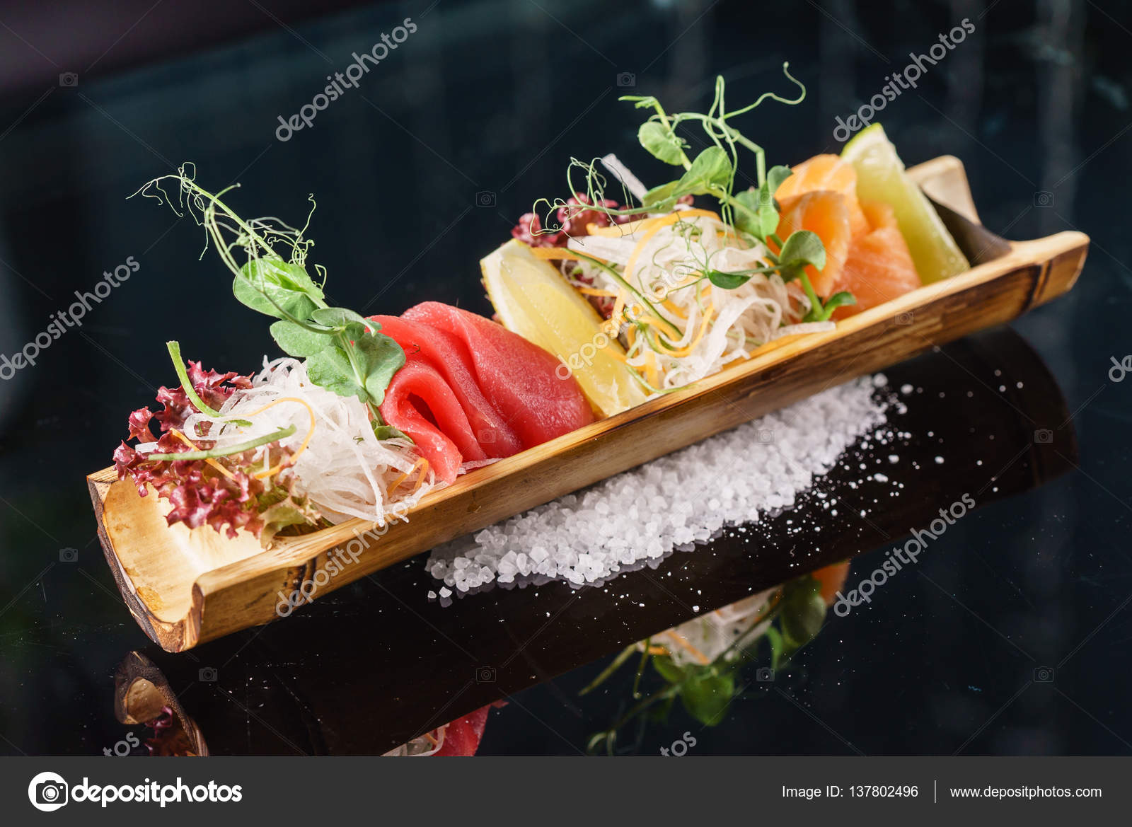 Delicious sashimi in bamboo — Stock Photo © Shebeko #137802496