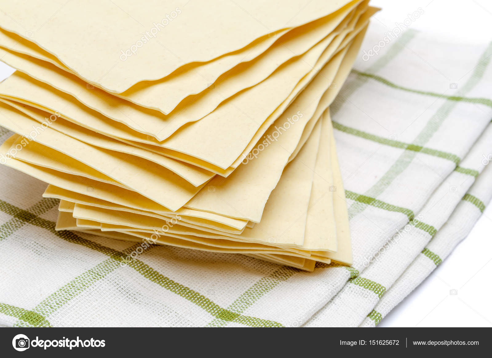 Dried uncooked lasagna pasta sheets Stock Photo by ©repinanatoly 151625672