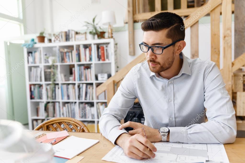 Young man architect in office — Stock Photo © SergeyNivens #156276624 Young man architect in office — Stock Photo © SergeyNivens #156276624
