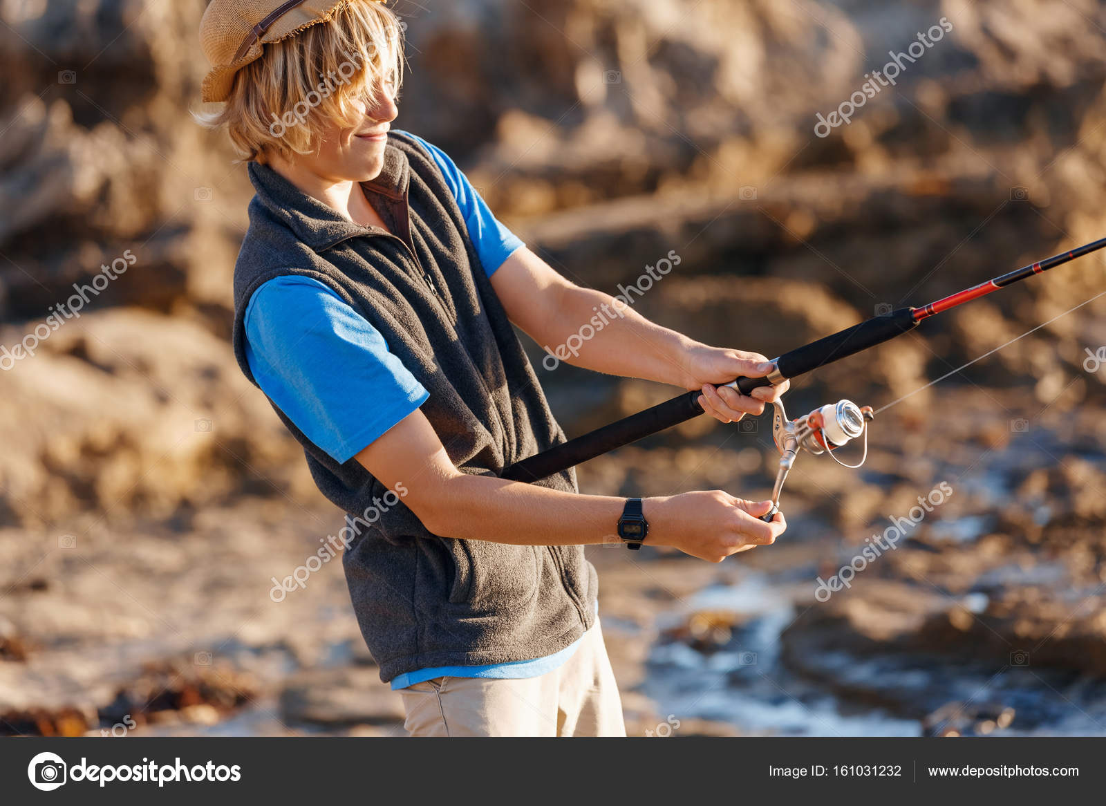 Teenage boy fishing at sea Stock Photo by ©SergeyNivens 161031232
