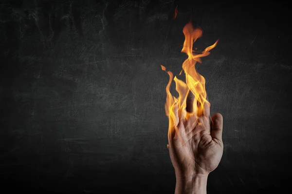 Fire burning in his hands — Stock Photo © SergeyNivens #190365168