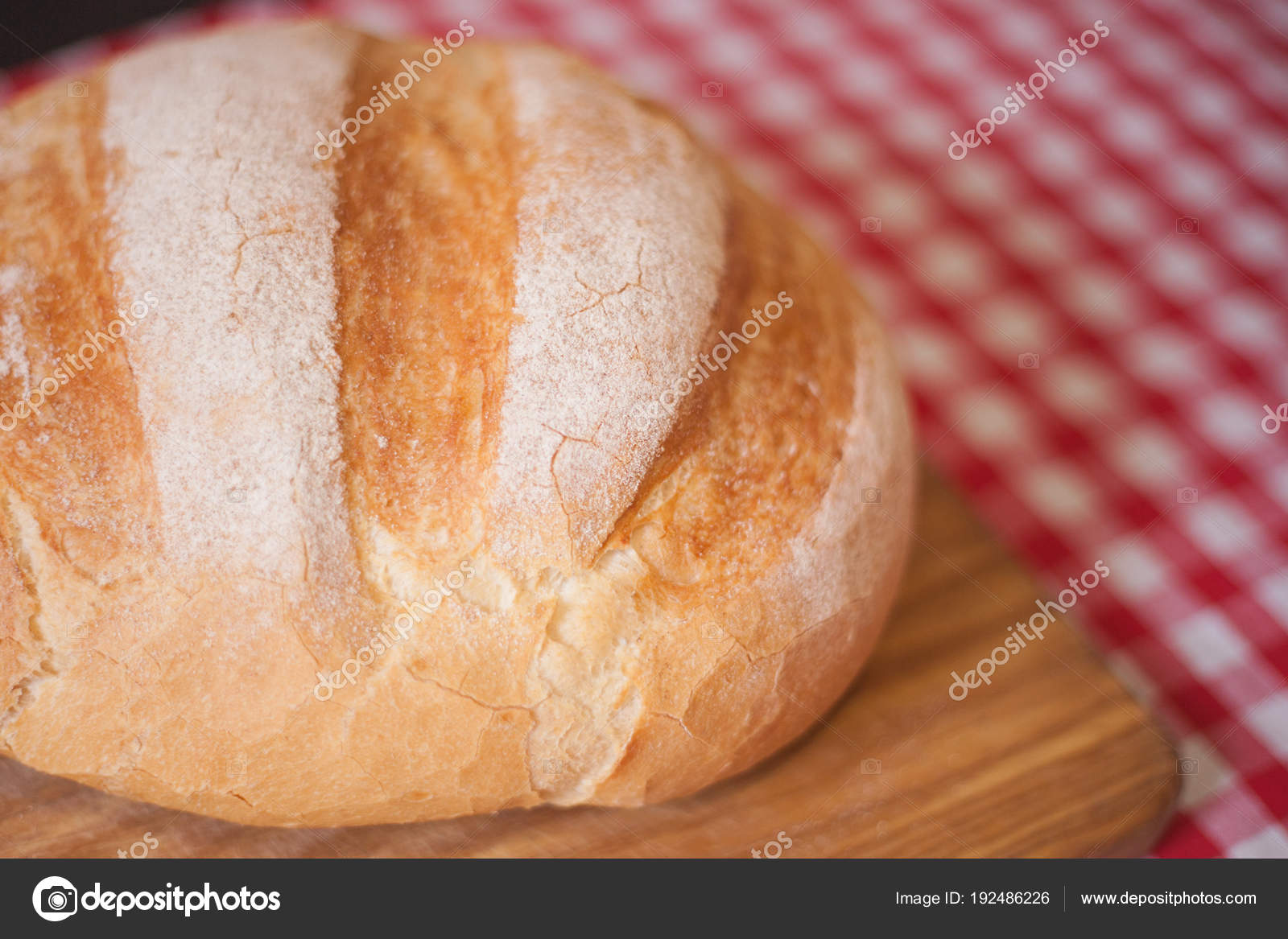 Crusty loaf at side view are on a wood table Stock Photo by ©namsilat ...