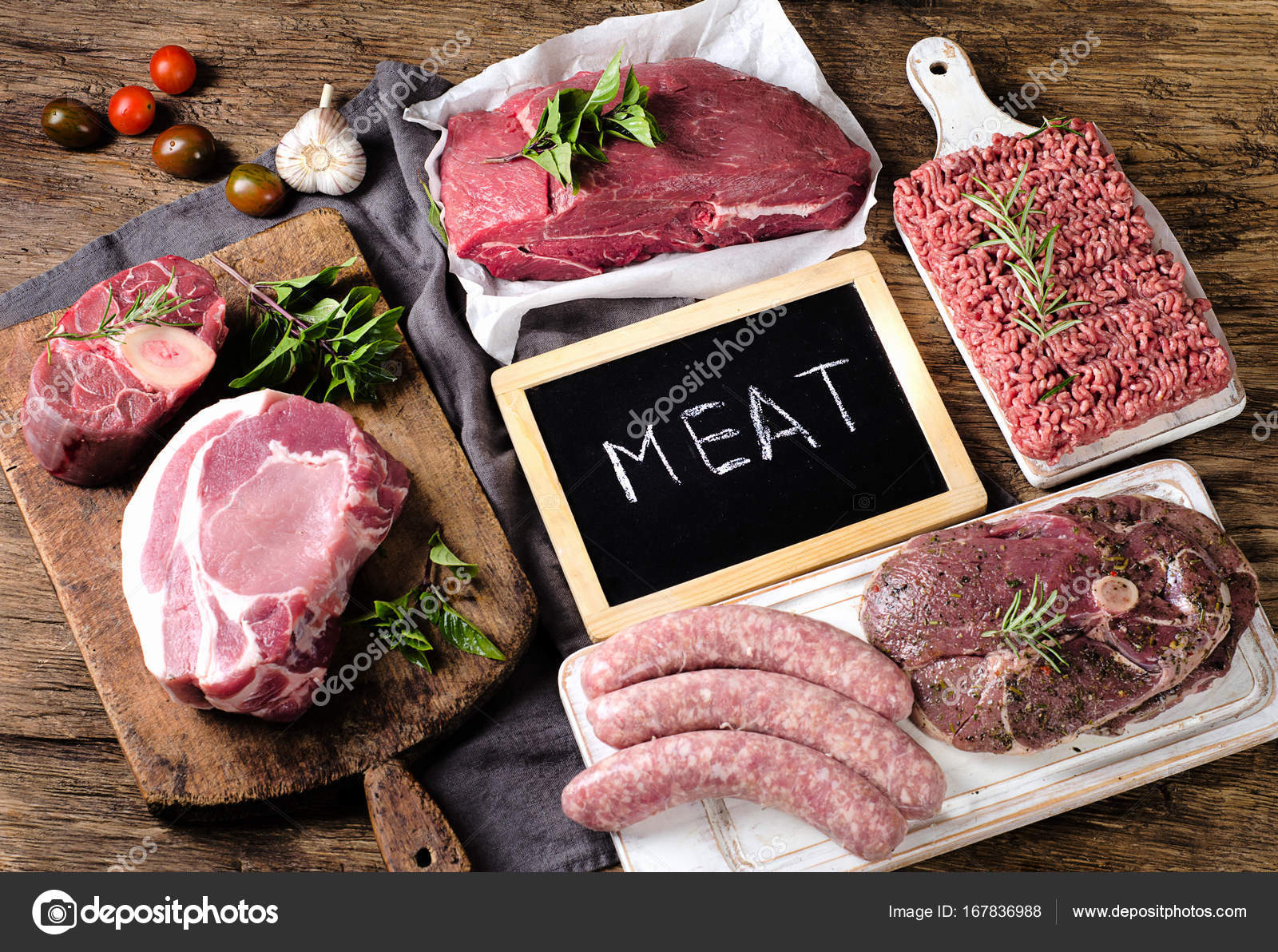Different types of fresh raw meat on a dark wooden background. Stock ...