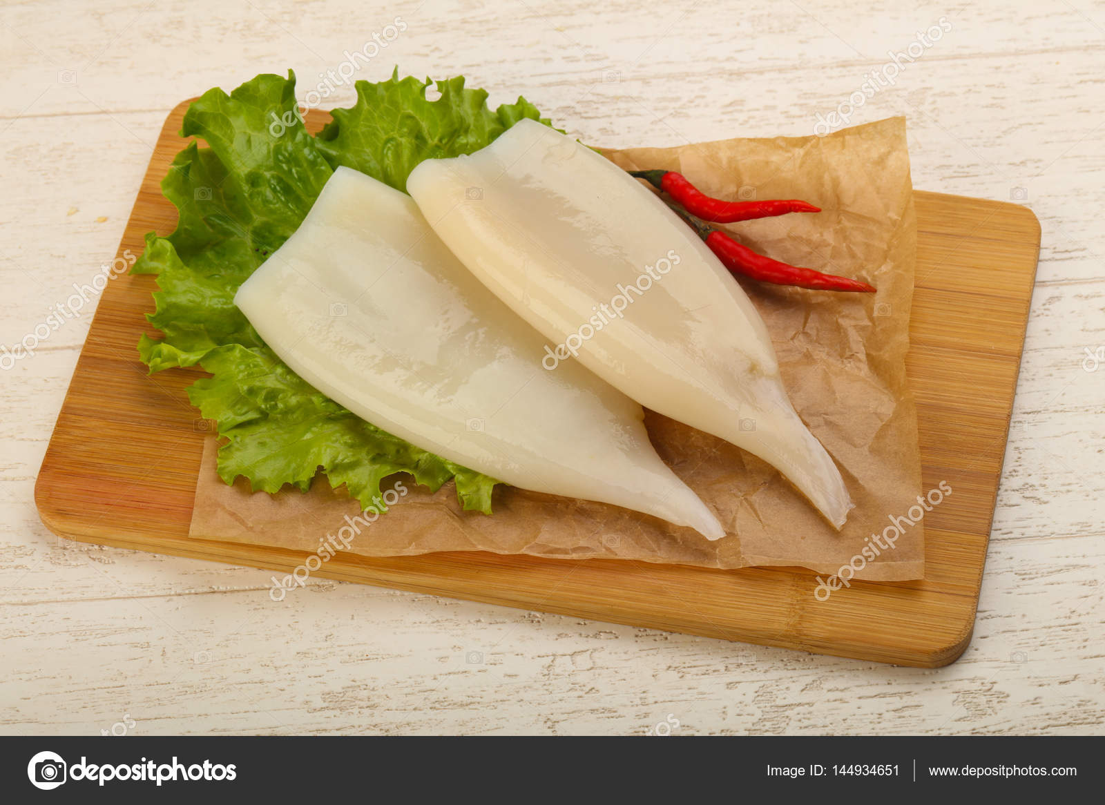 Raw squid fillet — Stock Photo © AndreySt #144934651