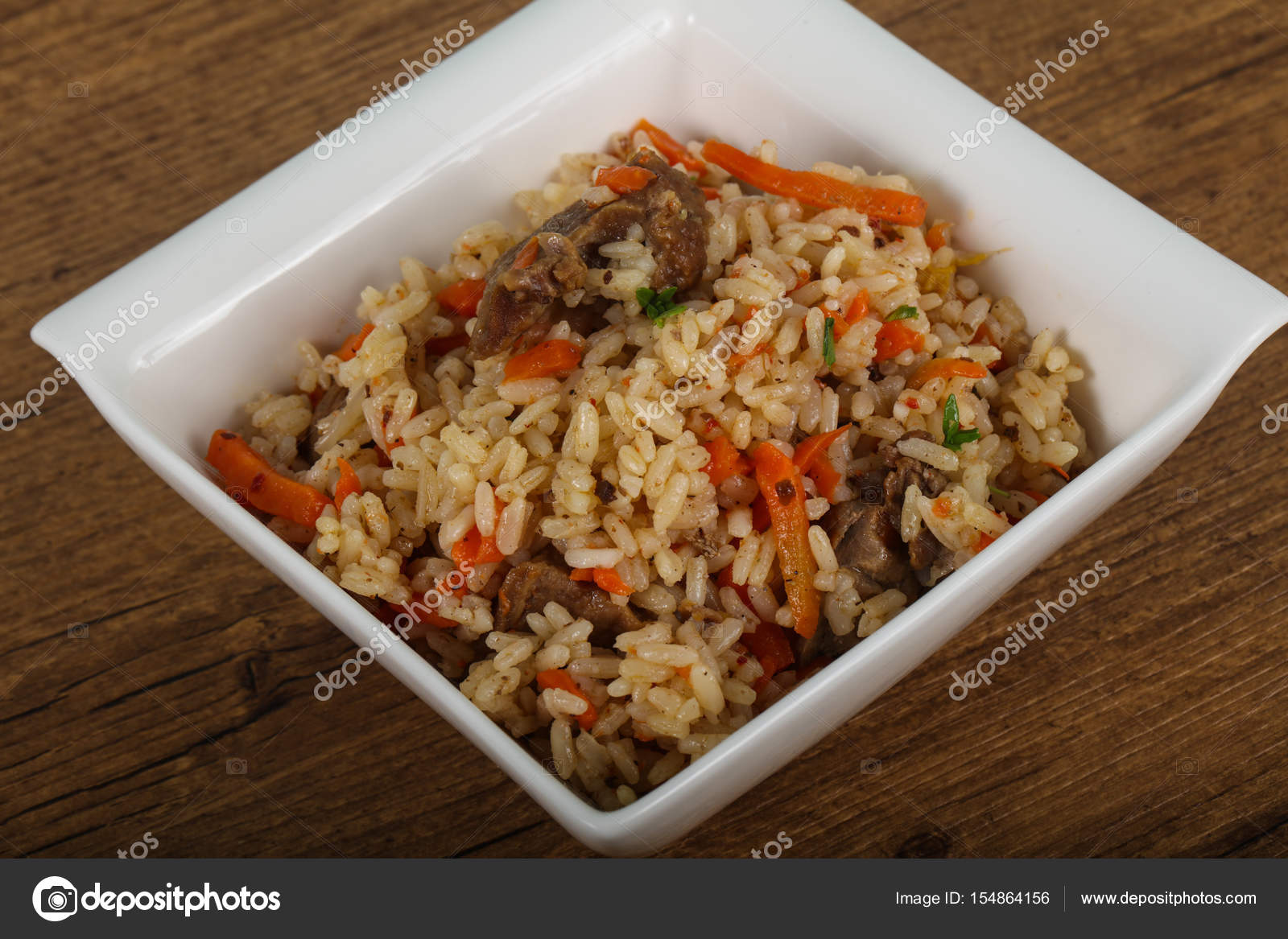 Pilaf with meat and carrot Stock Photo by ©AndreySt 154864156