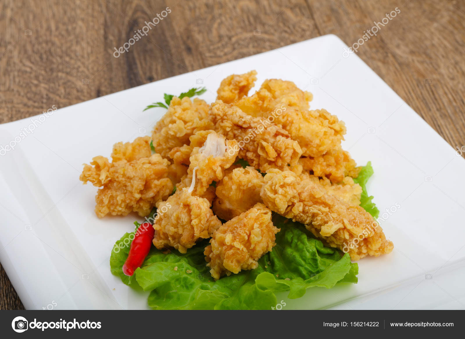 Crispy chicken nuggets Stock Photo by ©AndreySt 156214222