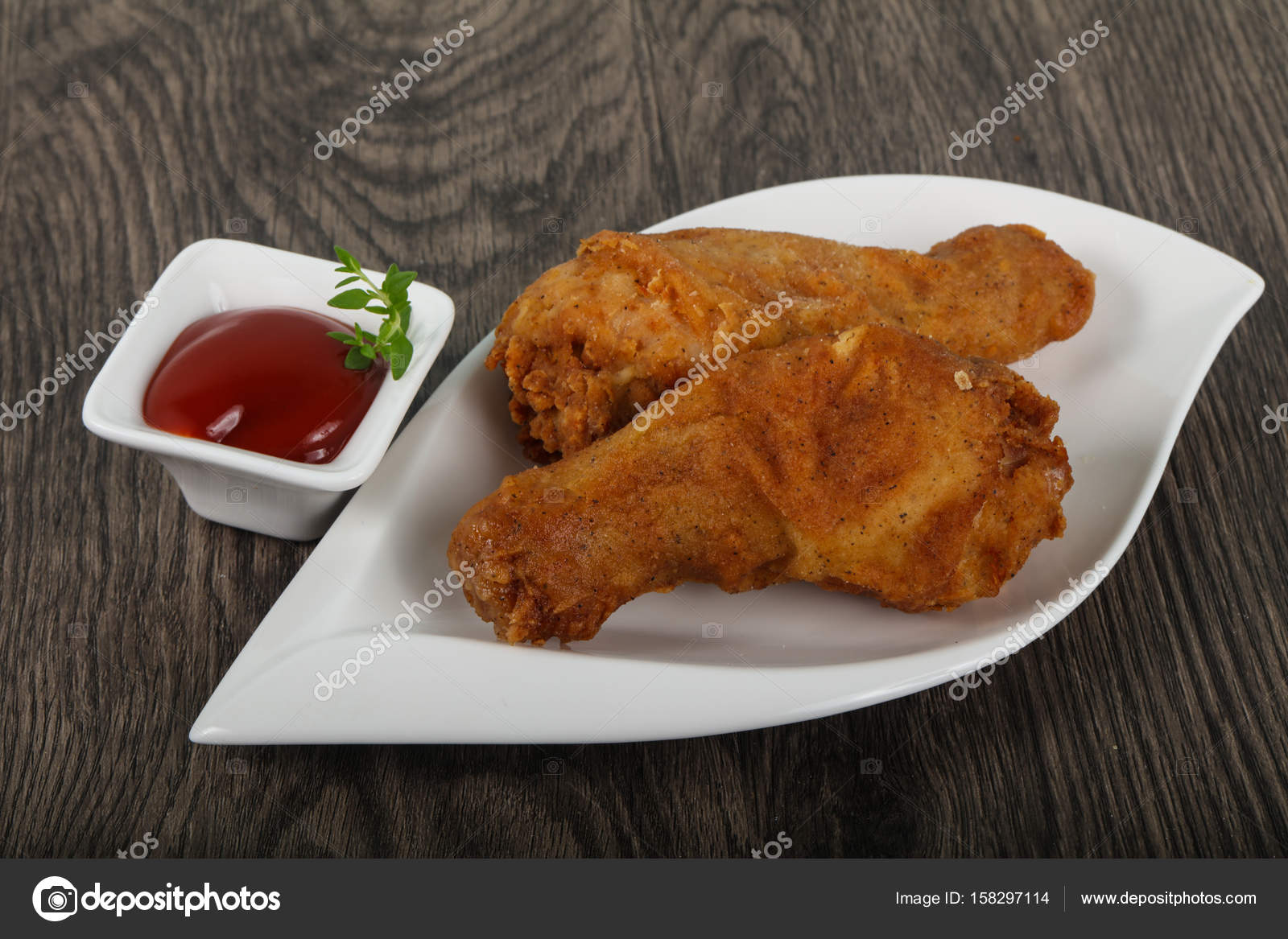 Crispy chicken legs Stock Photo by ©AndreySt 158297114