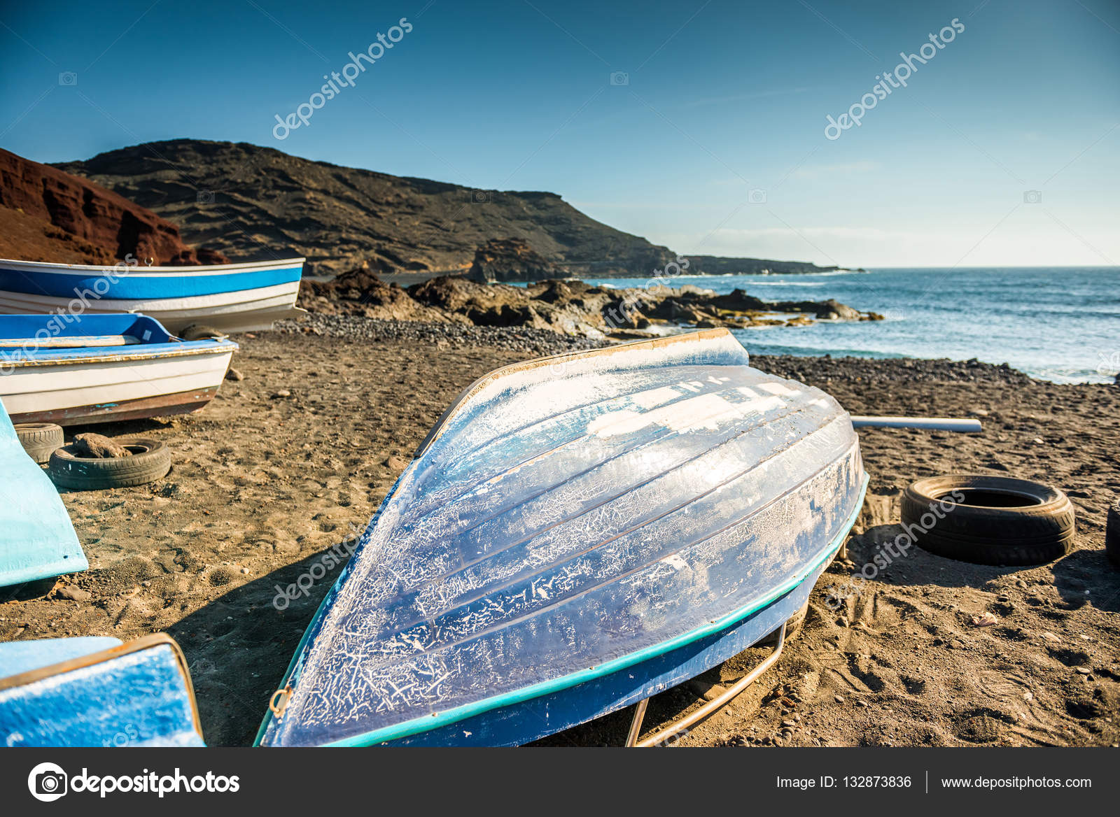 Inverted wooden boat on the shore of Lanzarote bay Stock Photo by ...