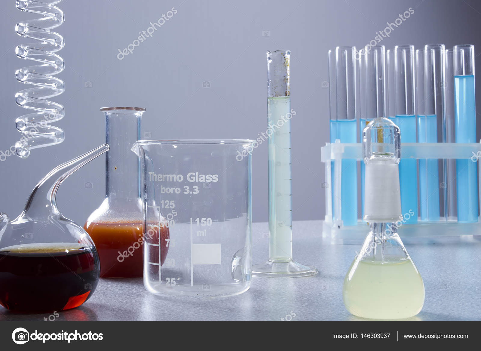 Multicolored liquids in laboratory containers — Stock Photo ...