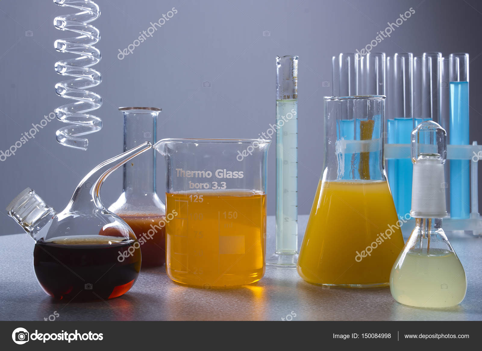 Multicolored liquids in laboratory containers Stock Photo by ...
