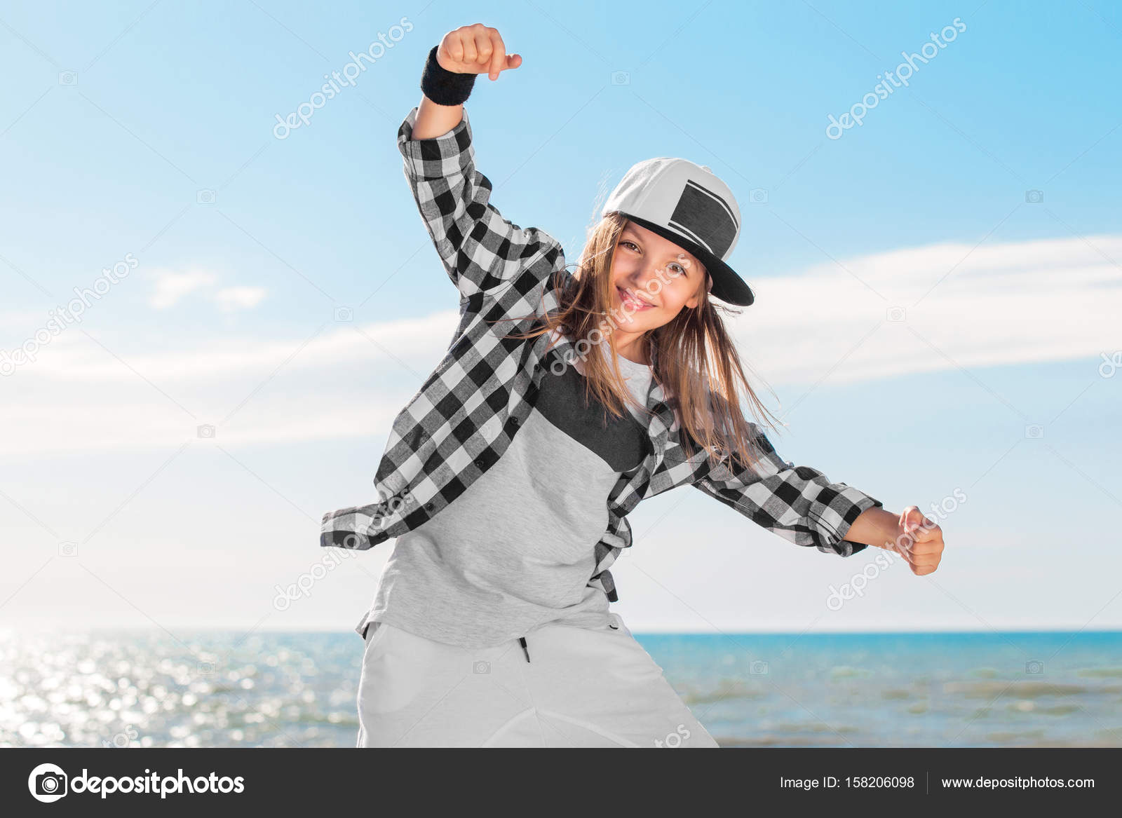 Fashion child dancing over sky background. Stock Photo by ©MikeOrlov ...