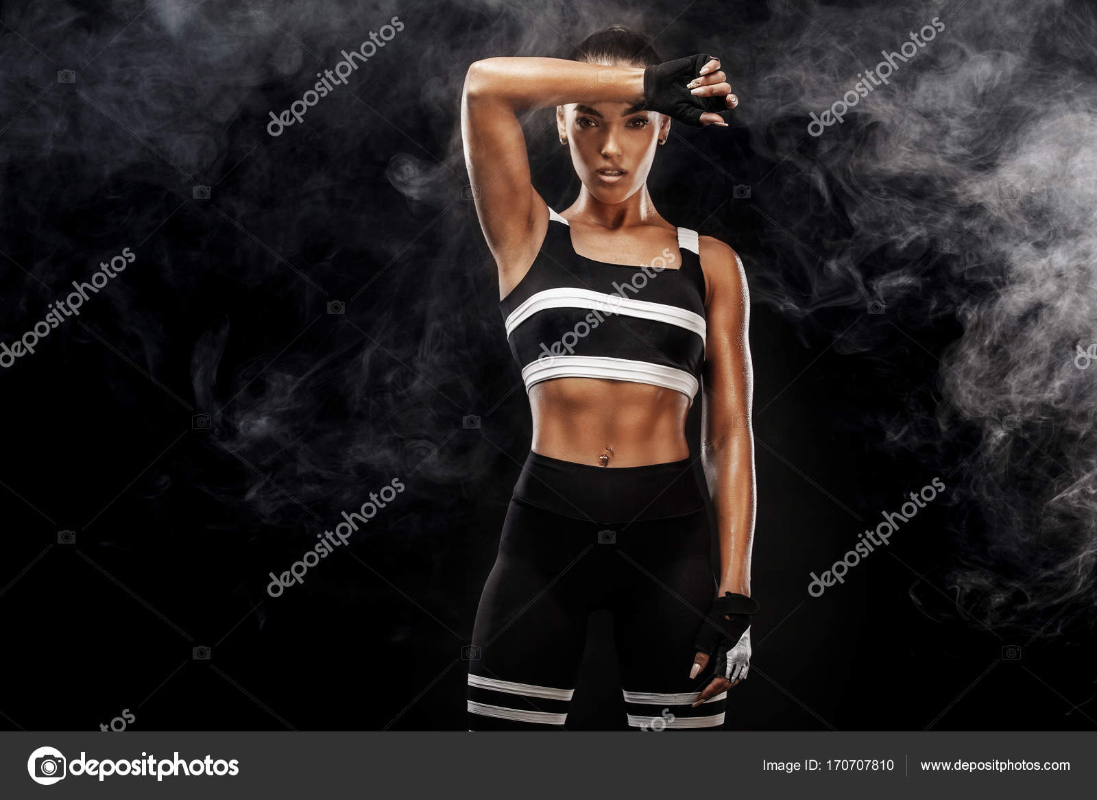 Sporty beautiful afro-american model, woman in sportwear makes fitness ...