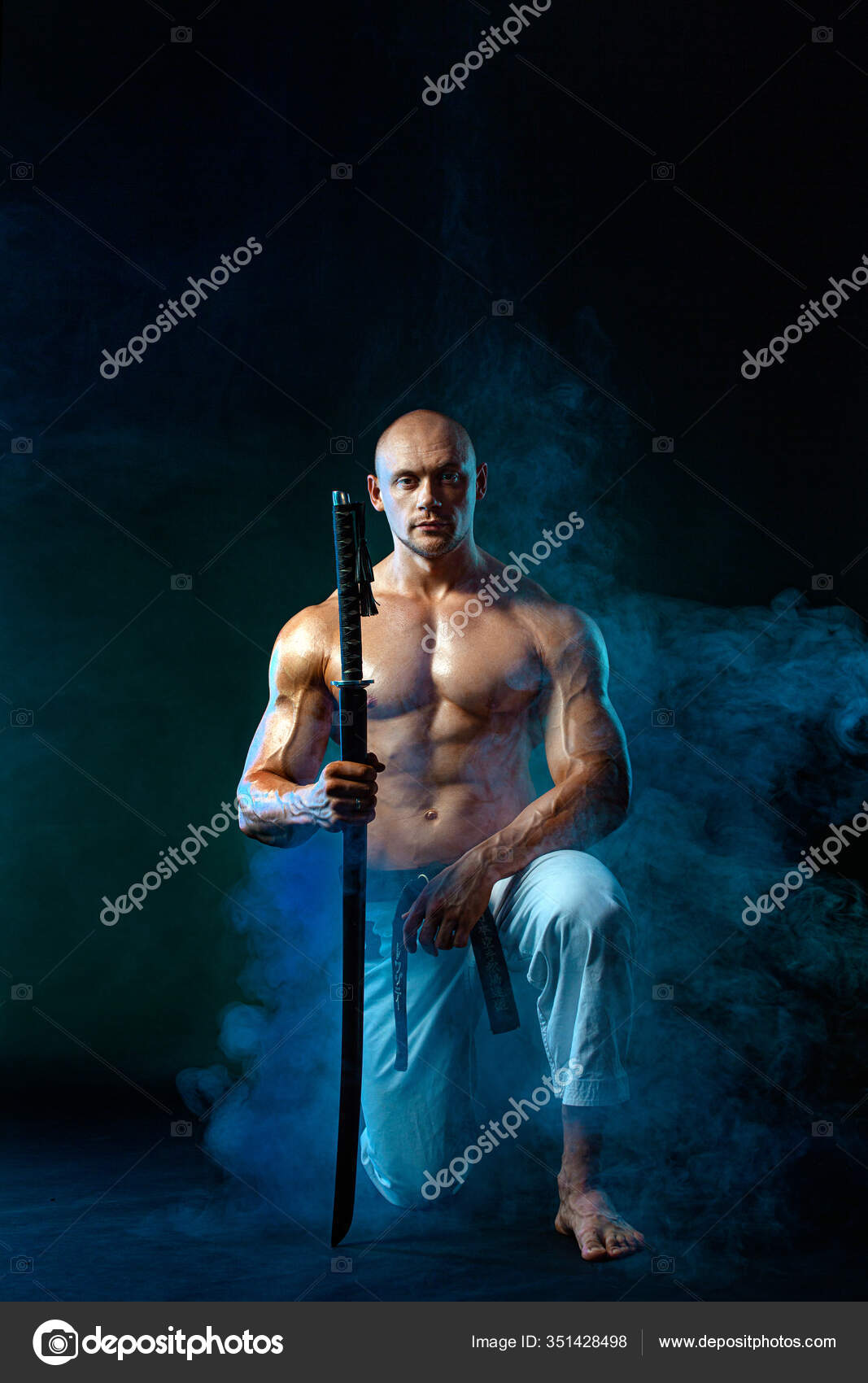 Karate fighter on black background with smoke. Shirtless man samurai ...