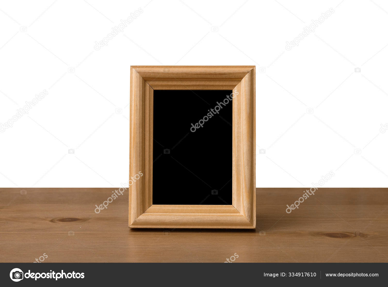 Photo frame on table — Stock Photo © avlntn #334917610