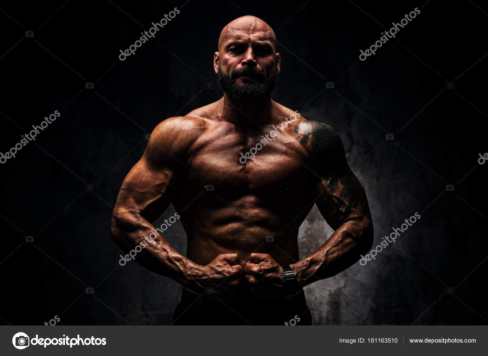 Strong man on dark background Stock Photo by ©chaoss 161163510