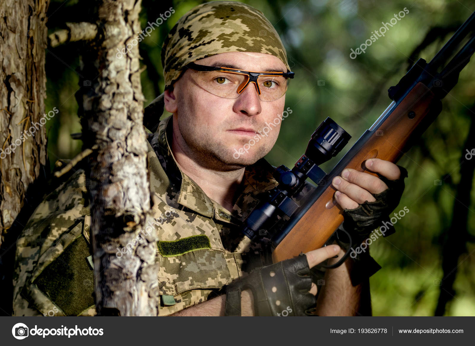 Young man with an air rifle — Stock Photo © Artex67 #193626778