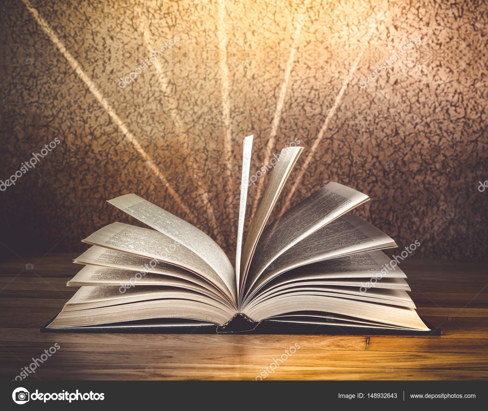 Old open book on grunge wooden table Stock Photo by ©Loraliu 148932643