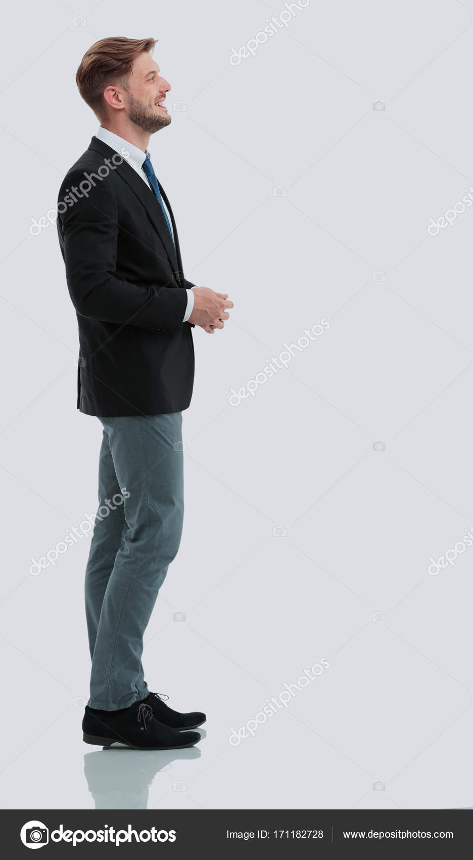 Side view of a smiling businessman standing , On white backgroun Stock ...