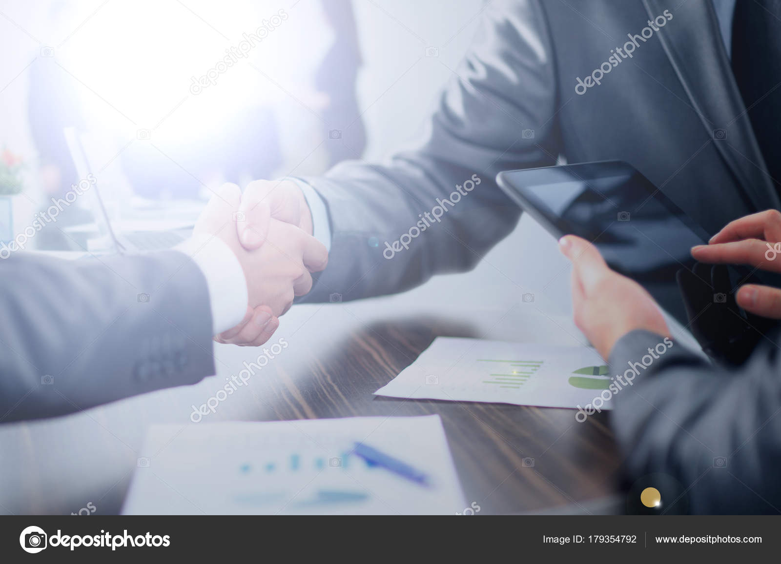 Concept - benefits from successful cooperation. the handshake bu Stock ...