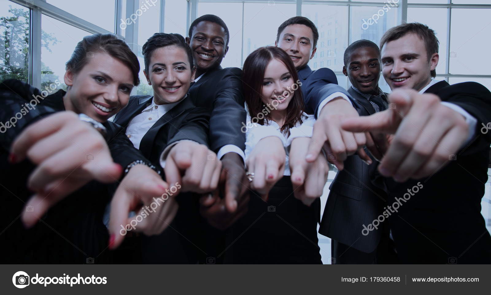 Group Of People Pointing And Laughing At Someone
