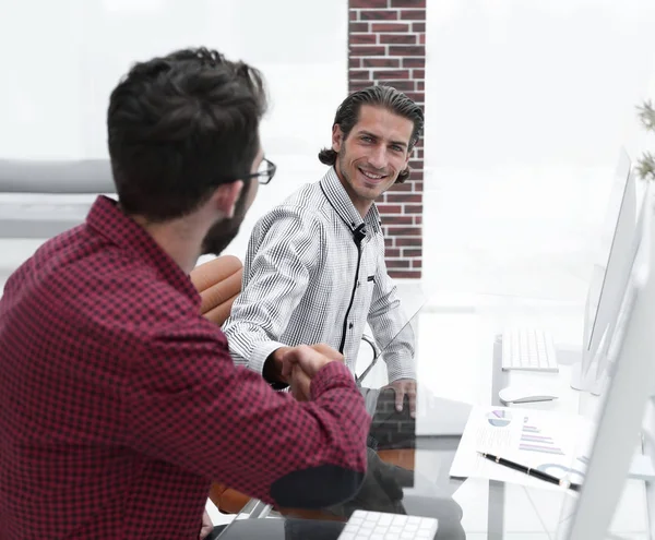 Two men handshake in the office - Stock Image - Everypixel