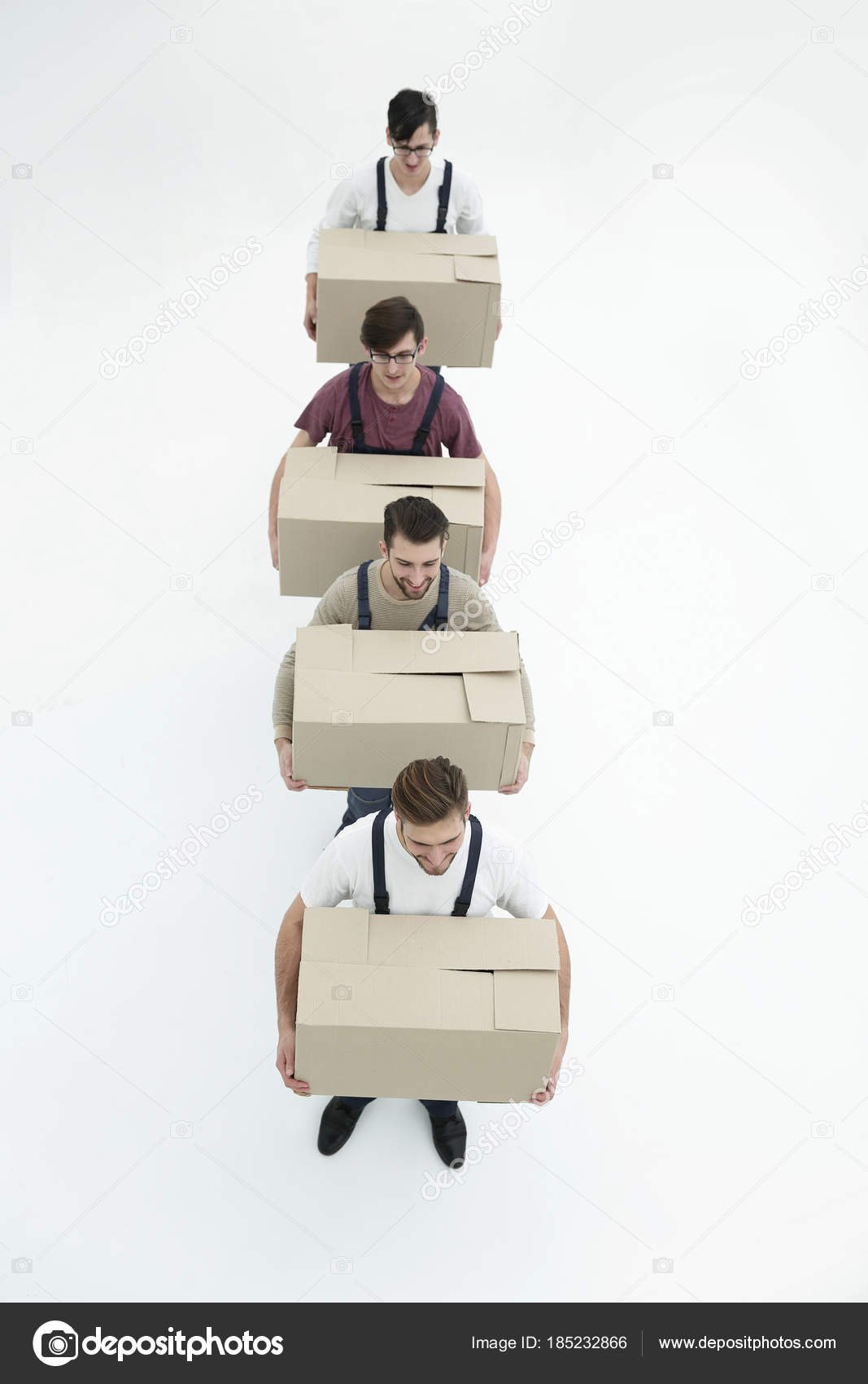 Young movers holding boxes standing in a row, isolated on white Stock ...