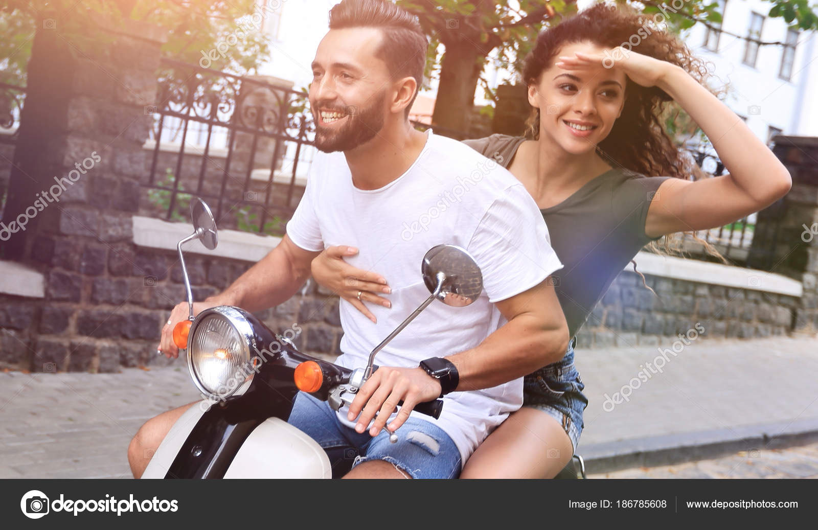 Young couple riding motor scooter in city Stock Photo by ©depositedhar ...