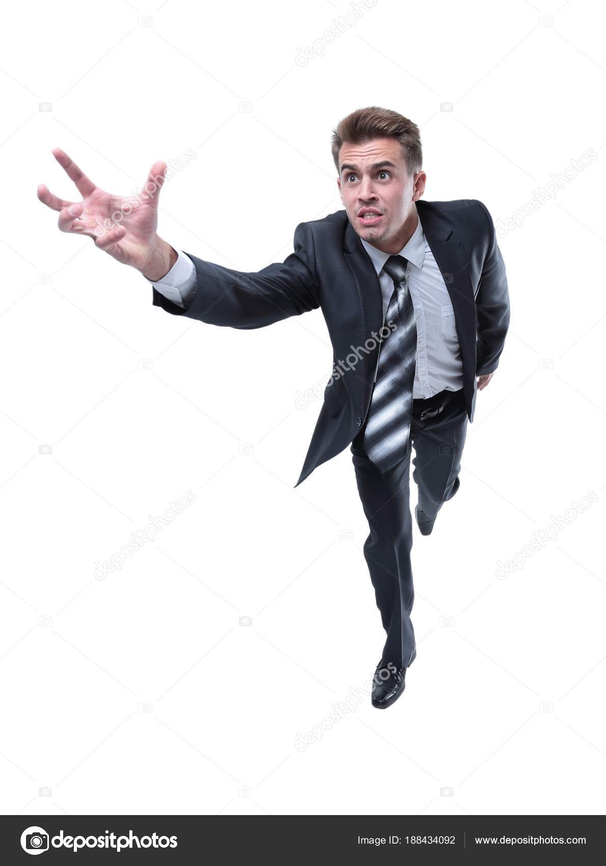 Businessman runs forward stretching out his hand Stock Photo by ...
