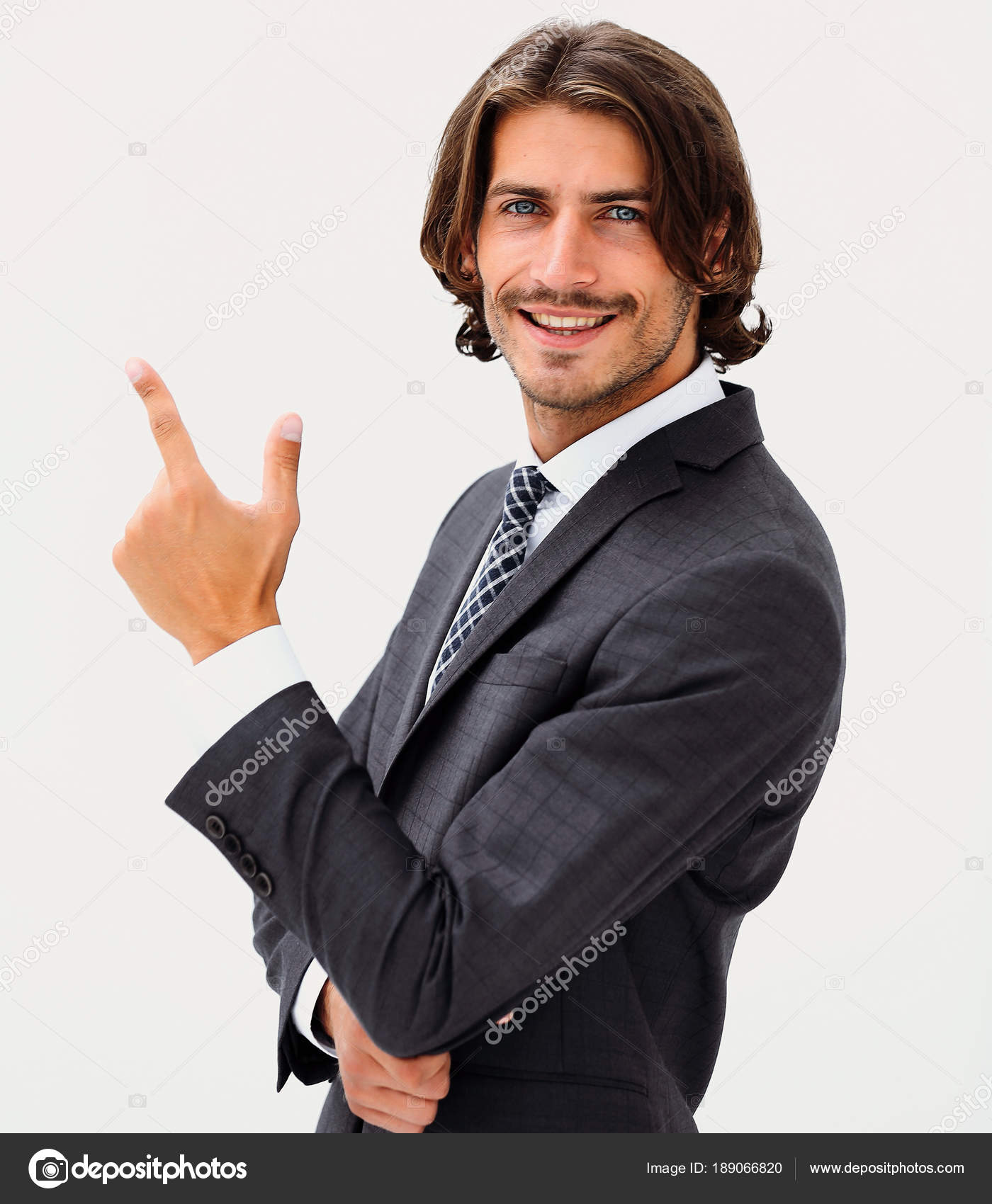 A young and handsome businessman pointing up with his finger Stock ...