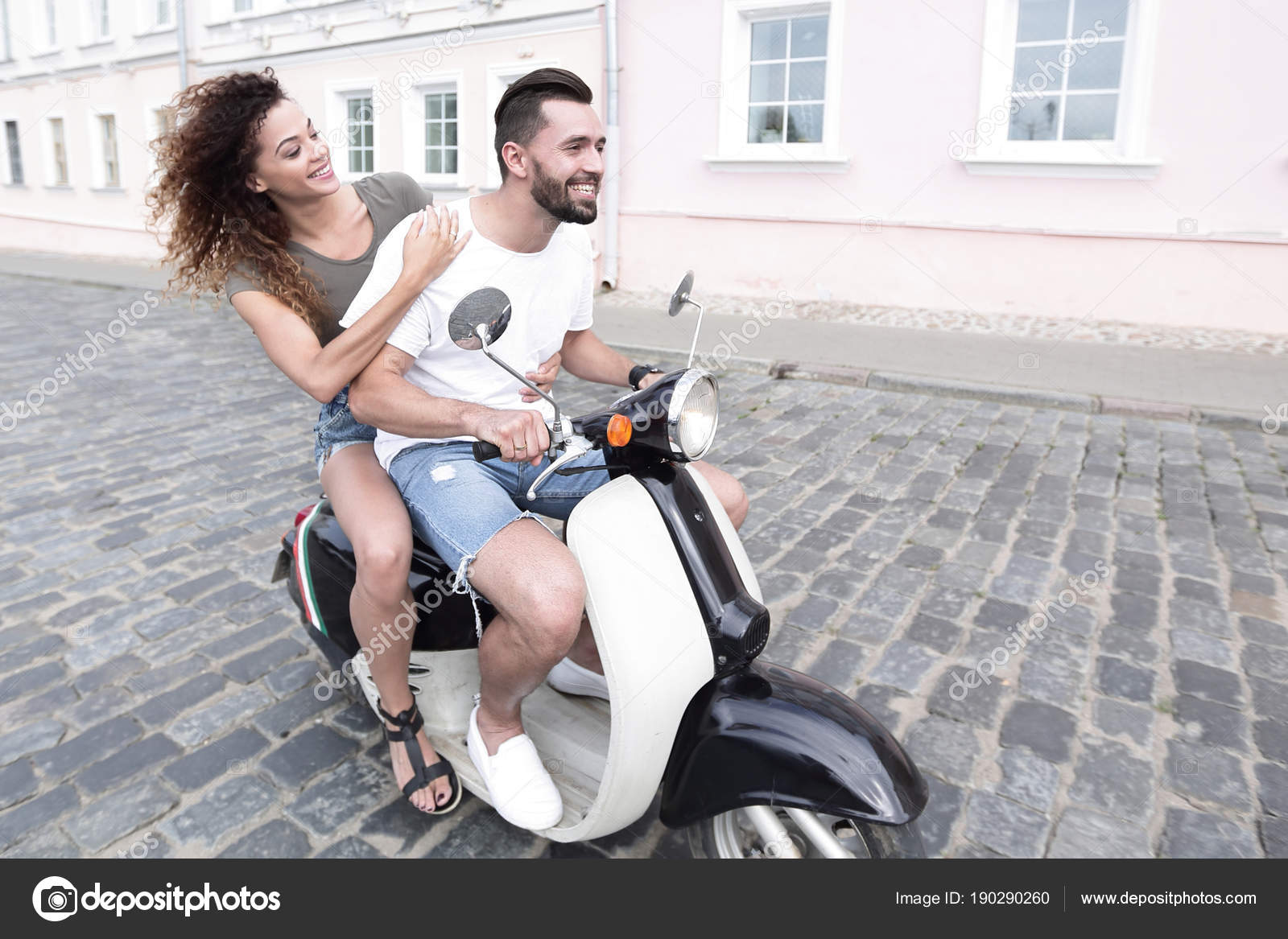 Full length side view of happy couple riding on retro motorbike Stock ...