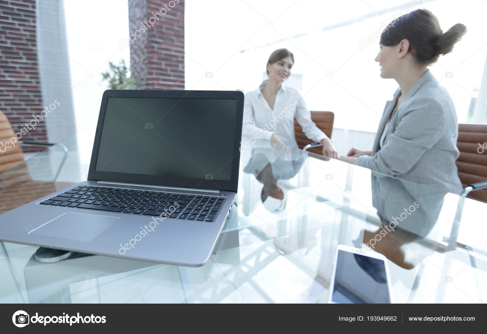 Laptop and a smartphone on the desktop of a businessman Stock Photo by ...