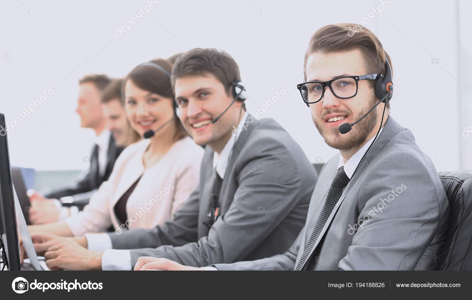 Customer service representative with headset in call center Stock Photo ...