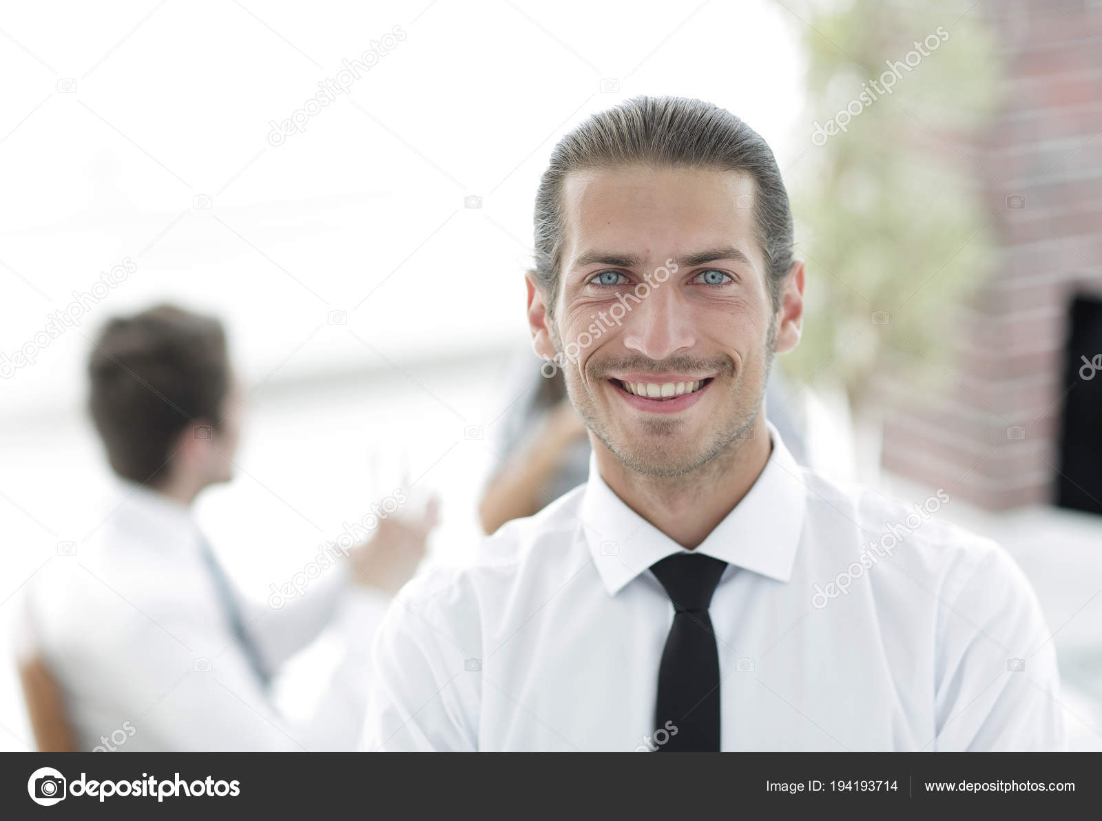 Successful young business men on blurred background — Stock Photo ...