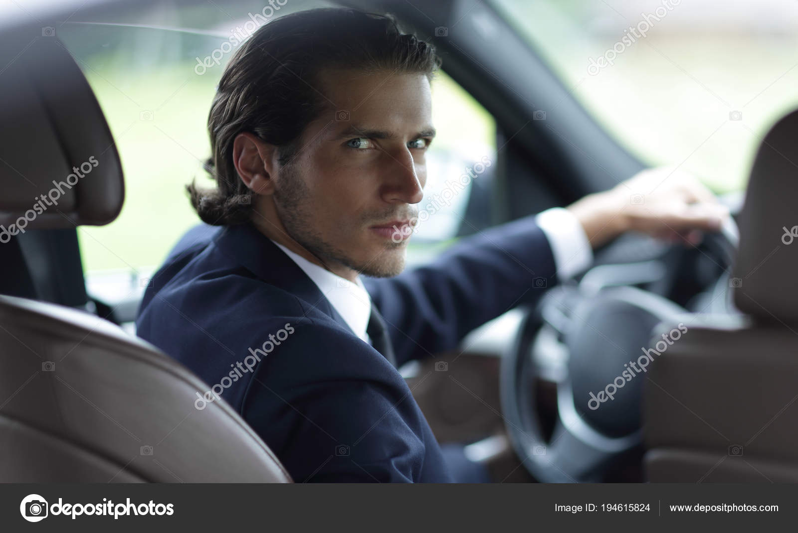Man sitting behind the wheel of a car Stock Photo by ©depositedhar ...