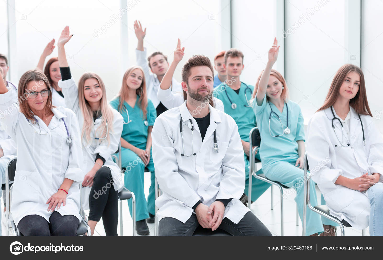 Top view. a group of smiling doctors pointing at you. — Stock Photo ...
