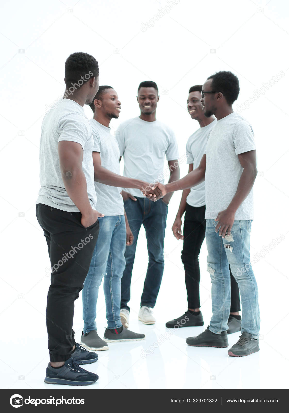 In full growth. smiling friends shaking hands. Stock Photo by ...