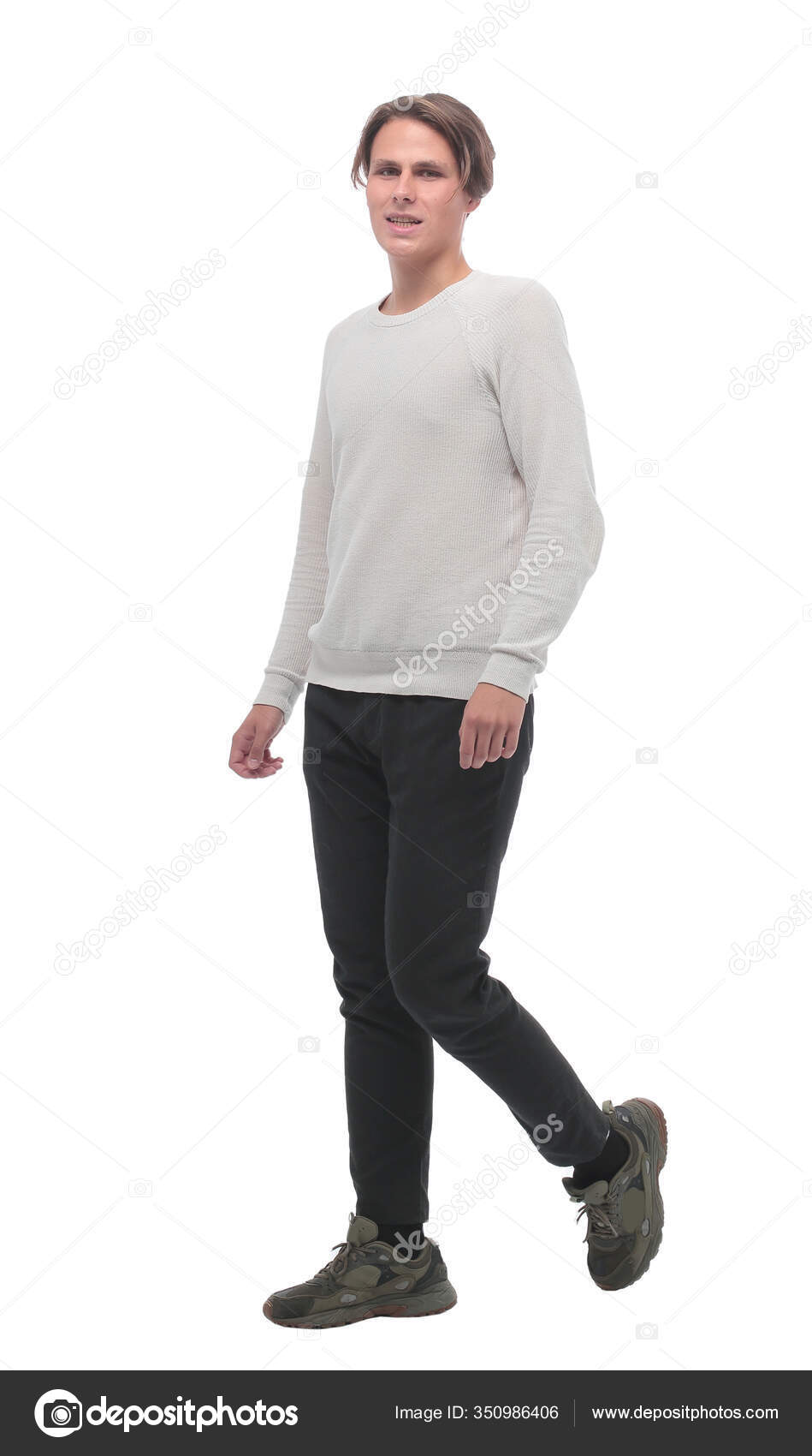 In full growth. confident young man striding forward. — Stock Photo ...